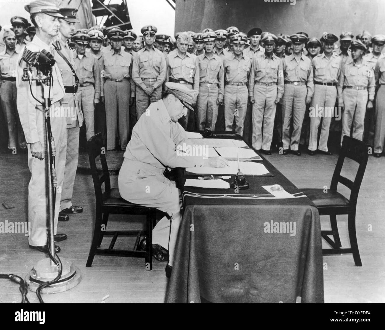 Douglas MacArthur signs Instrument of Surrender aboard USS Missouri ...