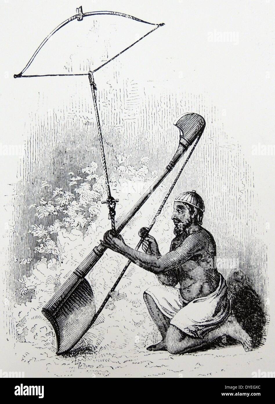 Bowing cotton in China to remove seeds, dirt and knots and to make it ...