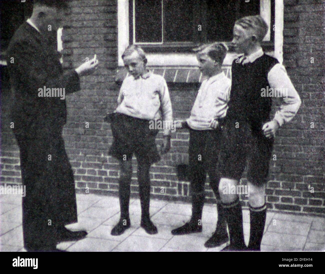 World War II - A dutch teacher speaks to a group of boys outside a ...