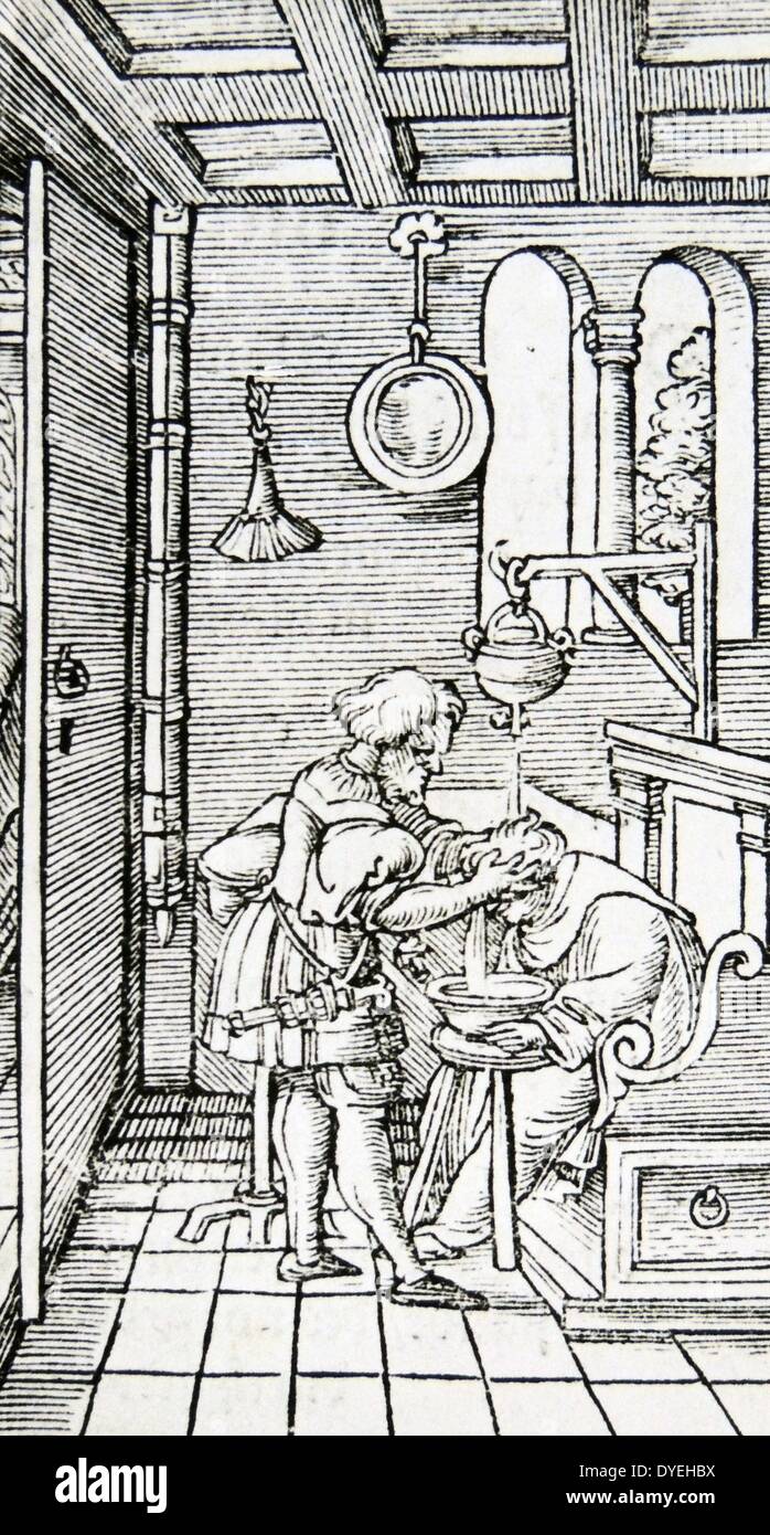 Barber shampooing a client, rinsing hair with water from reservoir ...