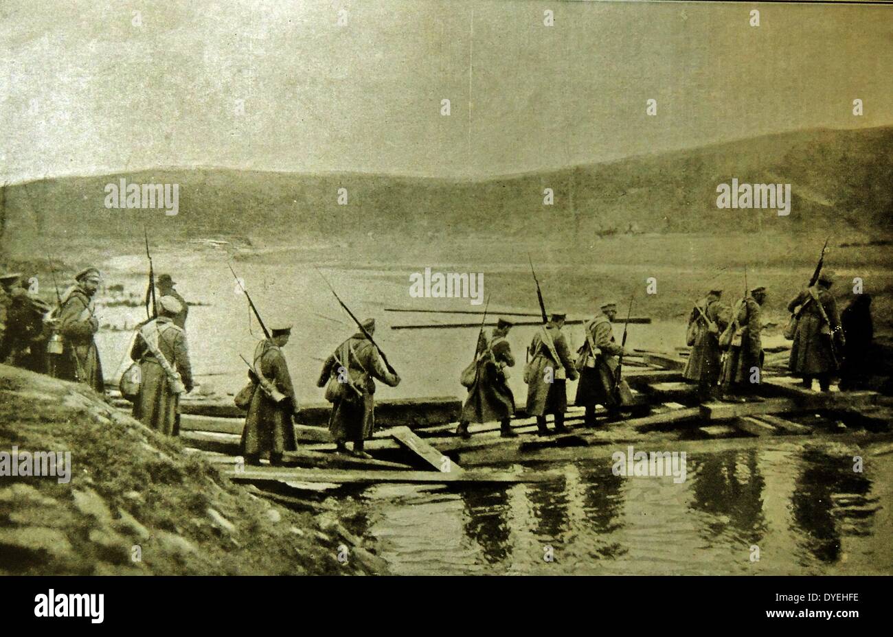 World War 1 - Russian soldiers crossing an improvised wooden bridge ...