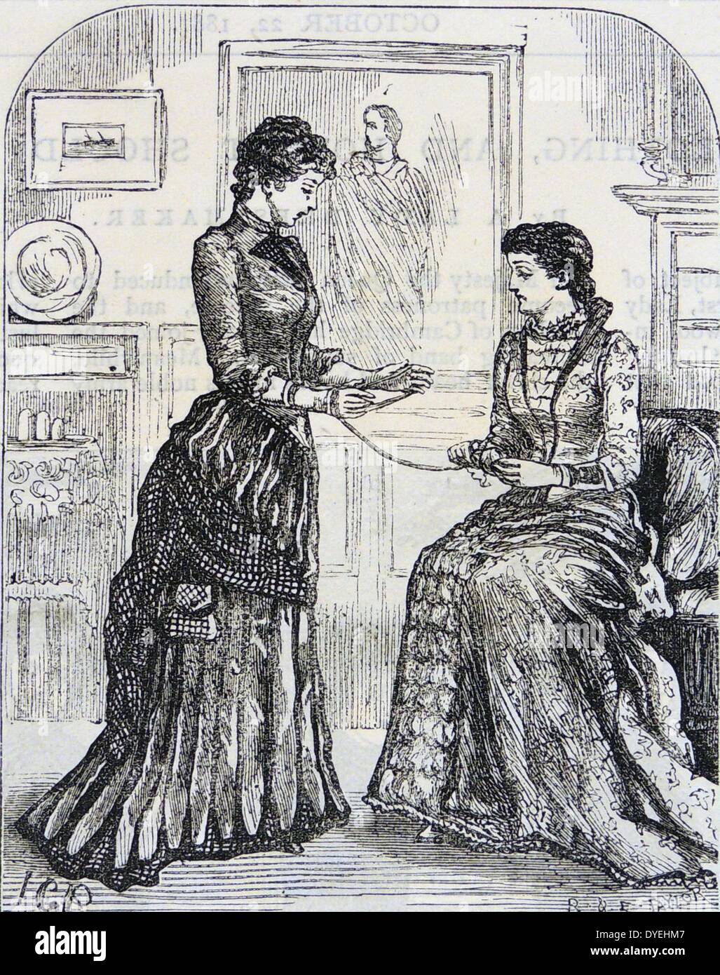 Young woman holding a hank of wool for her friend to wind into a ball ...