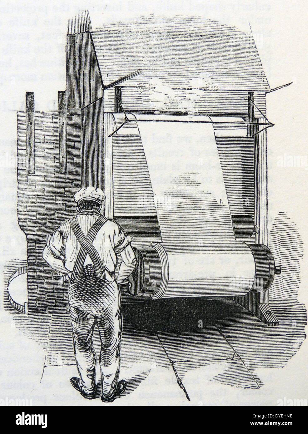 Singeing a length of cotton cloth to remove any hairy wisps and leave a ...