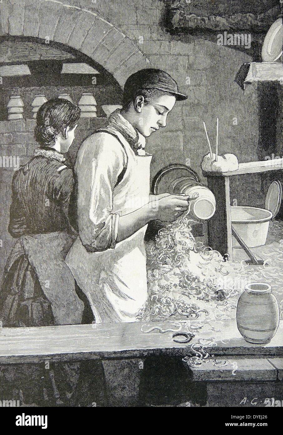 Turning a piece of pottery that has already been shaped on the potter's ...