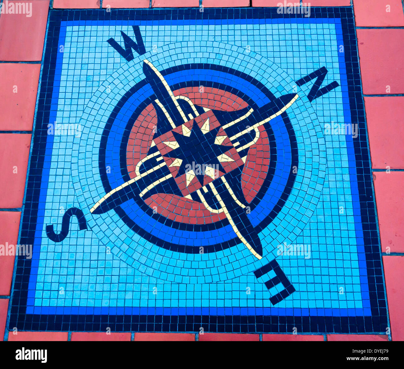 Compass on the sidewalk Stock Photo - Alamy