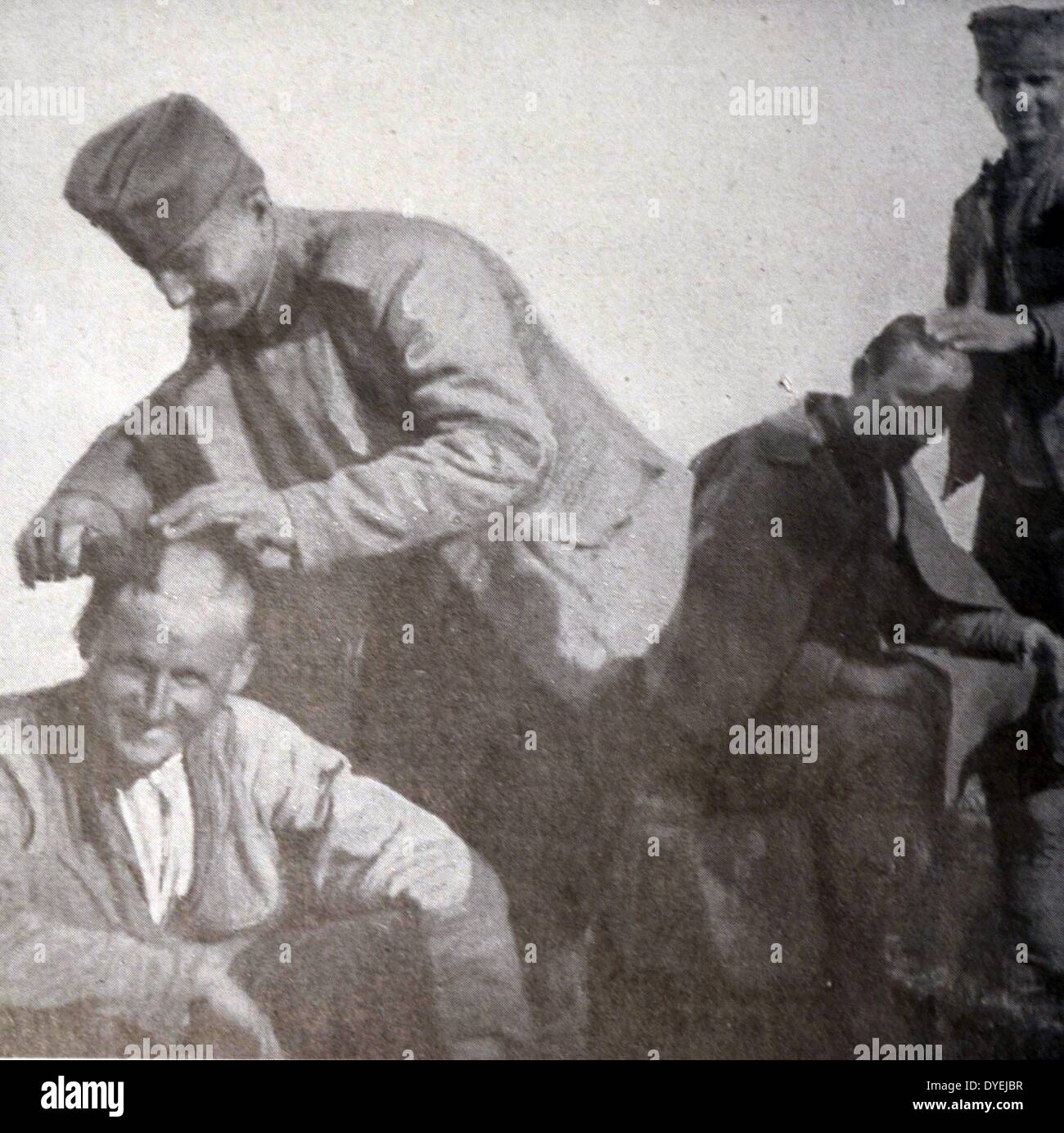 World War I - serbian forces receiving haircuts while camped on the ...