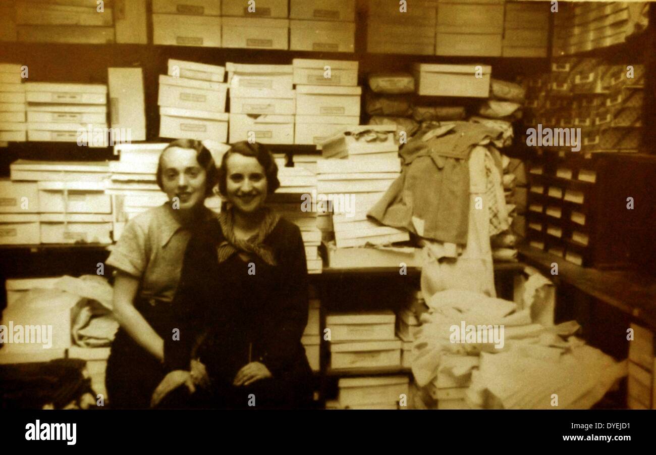 Two young female workers in a clothing store in London circa 1932-34 ...