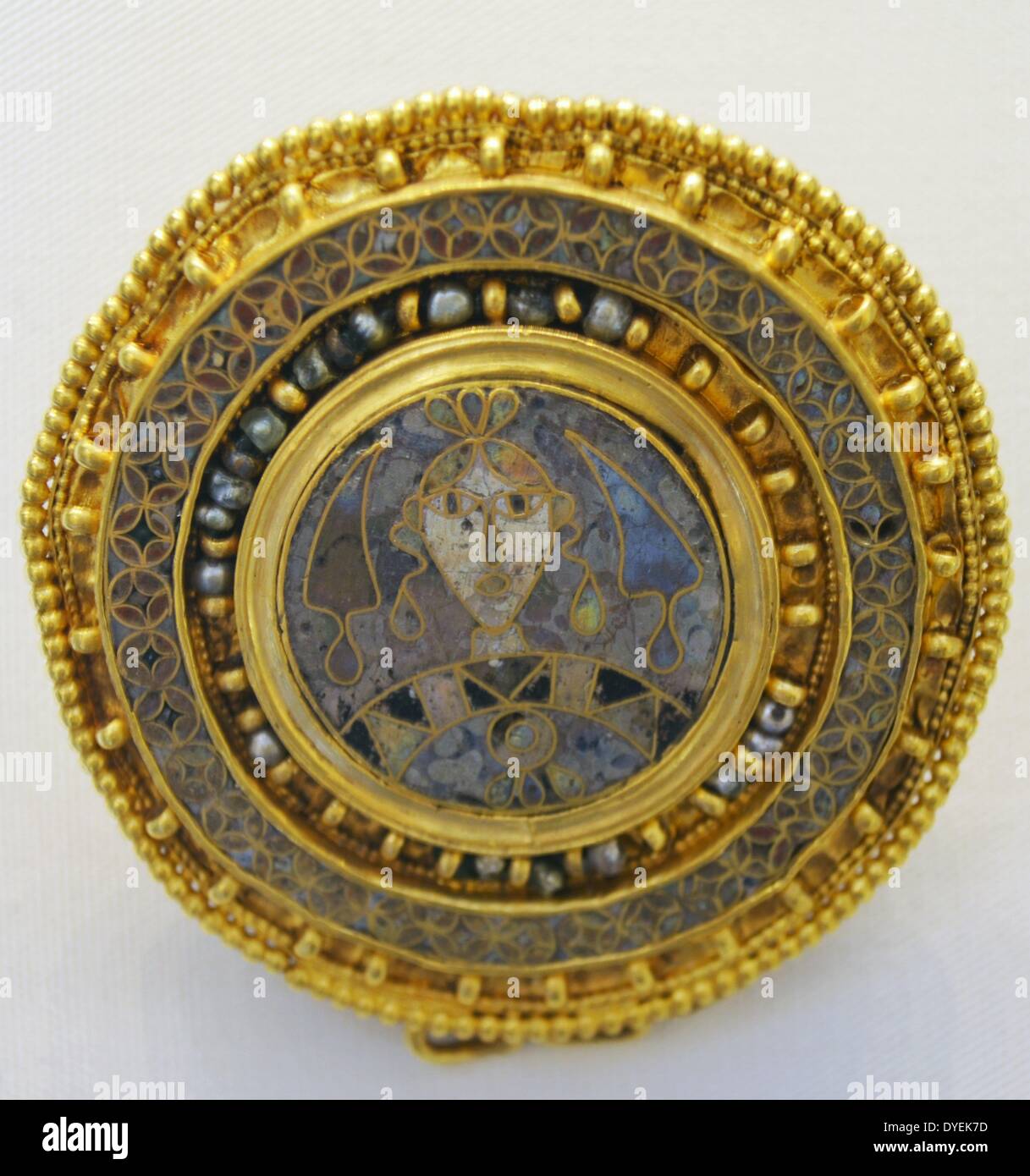 The Castellani Brooch 700 A.D. Central image depicts a human bust ...