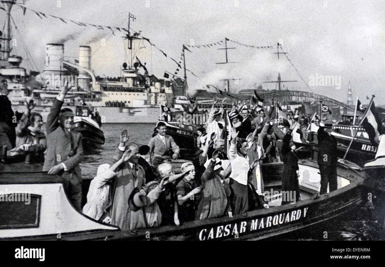 Nazi supporters gather to wave to Hitler as he passes through the port ...