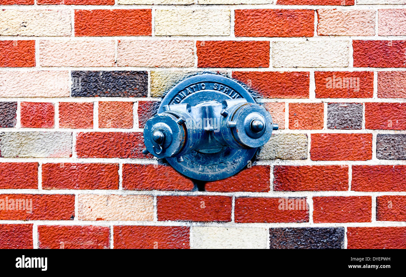 Fire Hydrant in the wall Stock Photo - Alamy