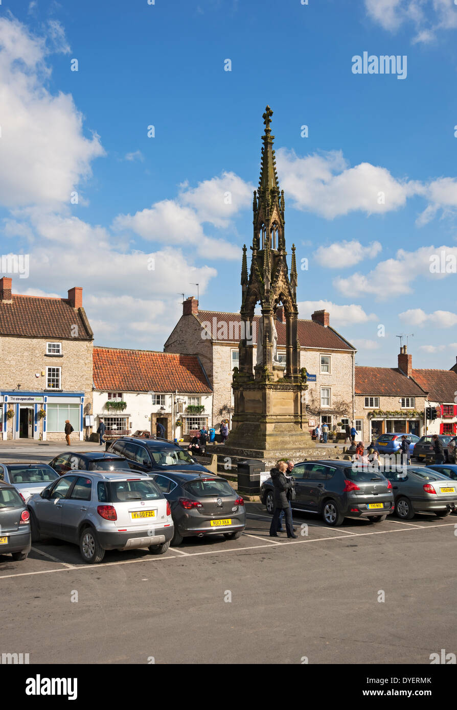 Cars car parked parking beside Lord Feversham Memorial in the town ...
