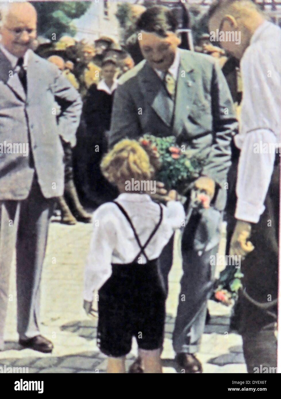 Hitler with adoring supporters. These photographs were taken to enhance ...