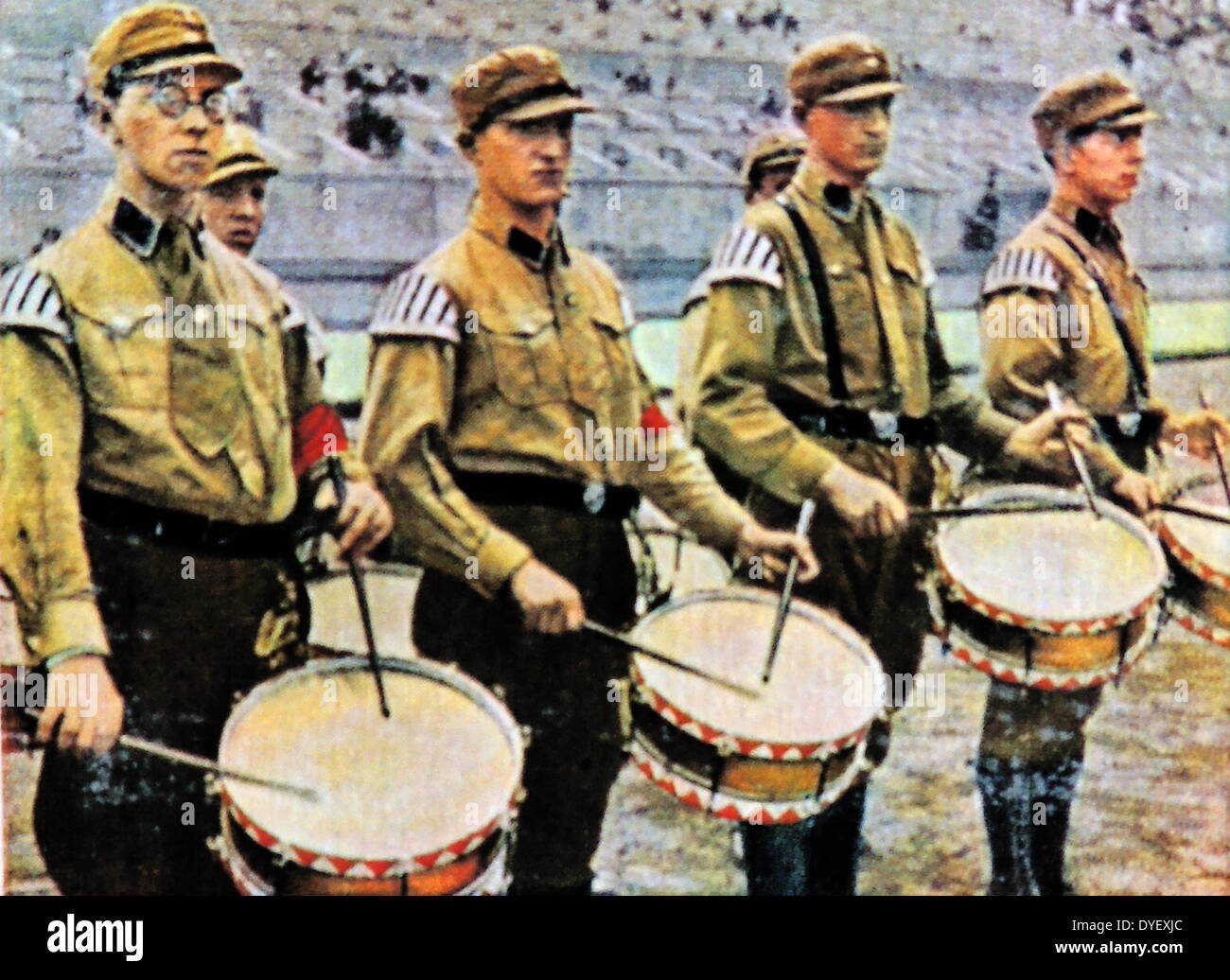 Nazi uniformed musician palying instrument at a rally. Germany circa ...