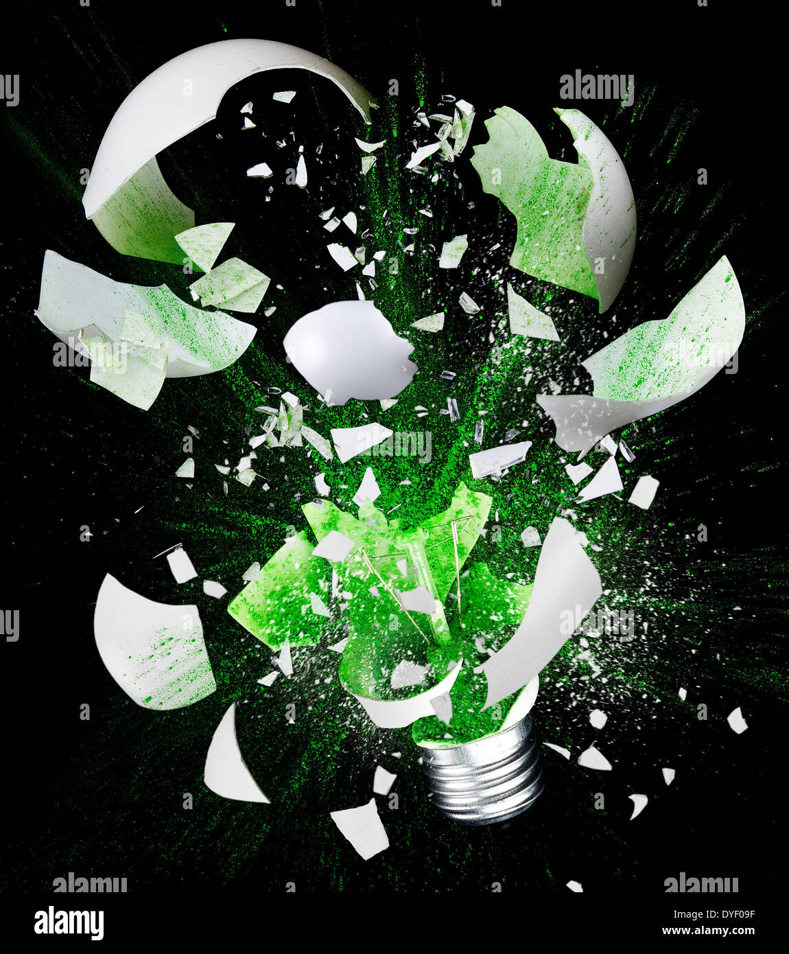 A WHITE LIGHT BULB EXPLODING GREEN POWDER FROM INSIDE ON A BLACK ...
