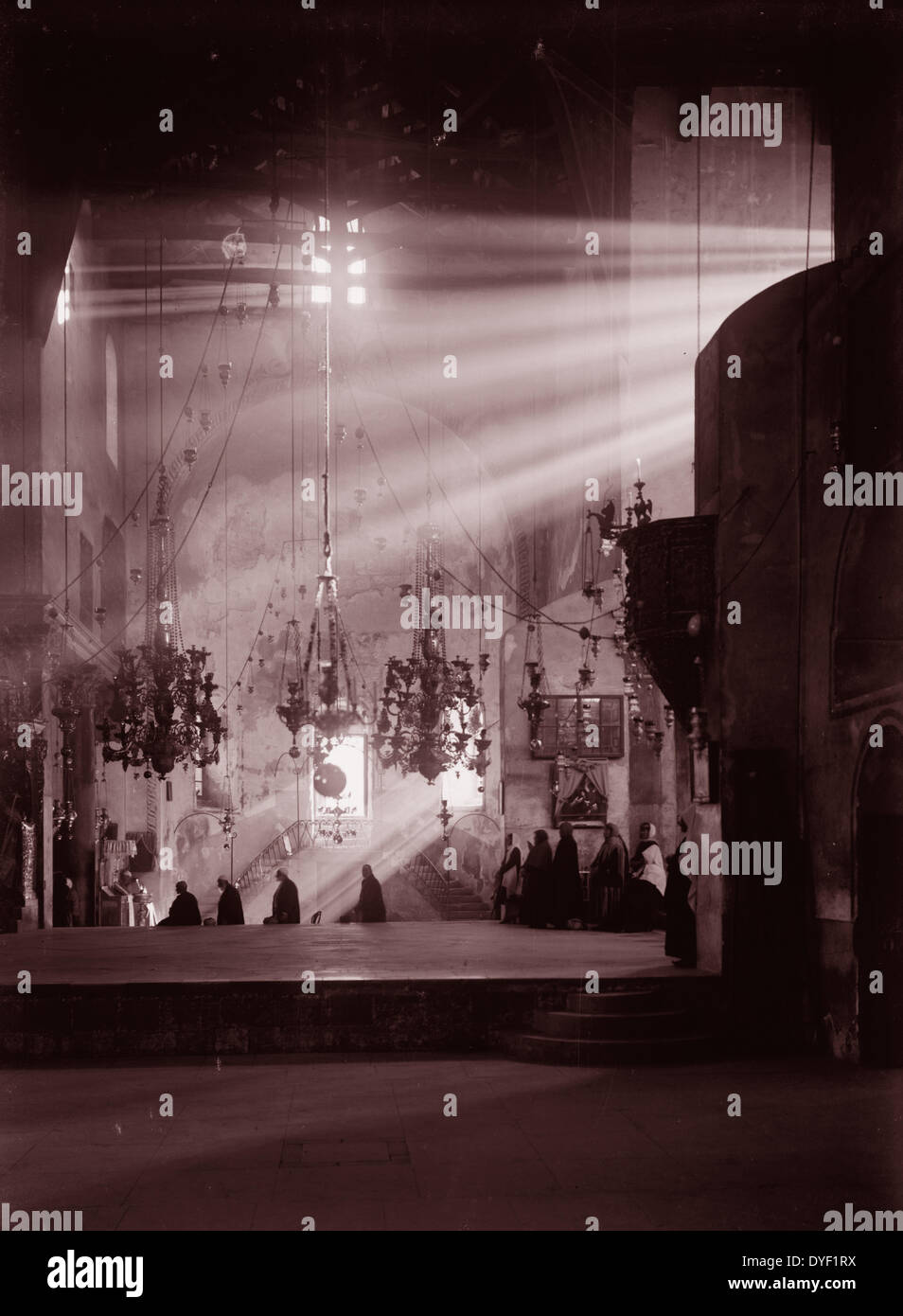 Bethlehem. Church of the Nativity. (Dark interior lit by sun rays ...