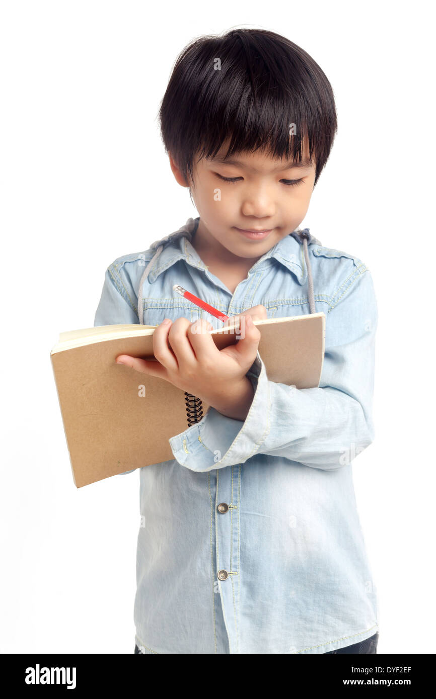 Boy writing on notebook with smile isolated on white background Stock ...