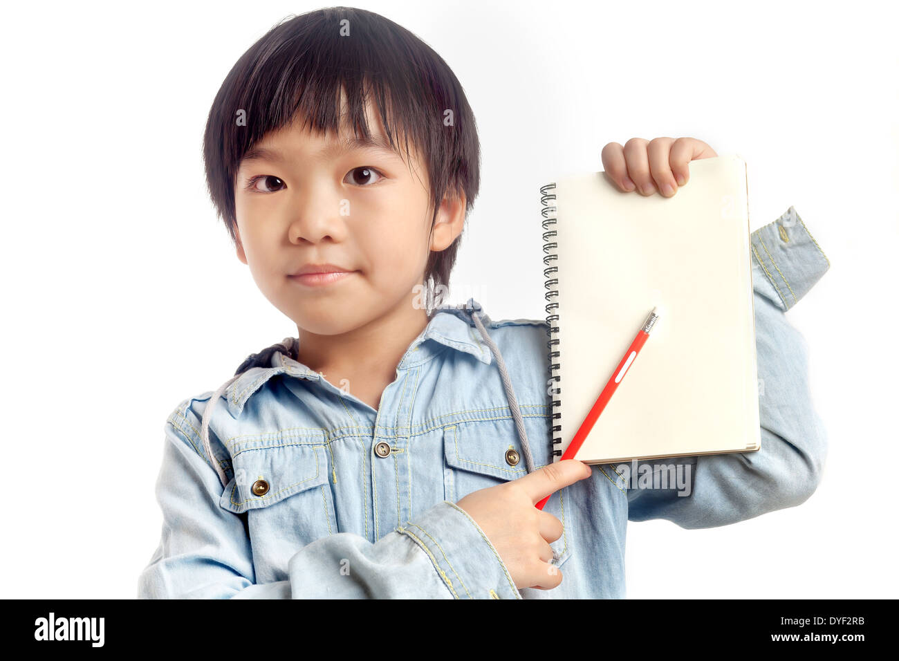 Boy holding blank notebook with pencil on white background Stock Photo ...