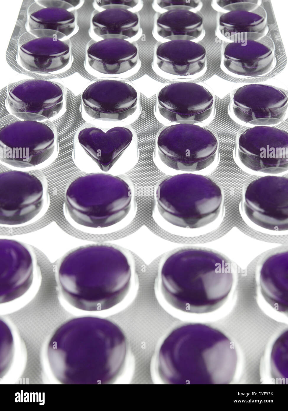 PACKETS OF PURPLE THROAT LOZENGES WITH ONE AS A HEART Stock Photo - Alamy