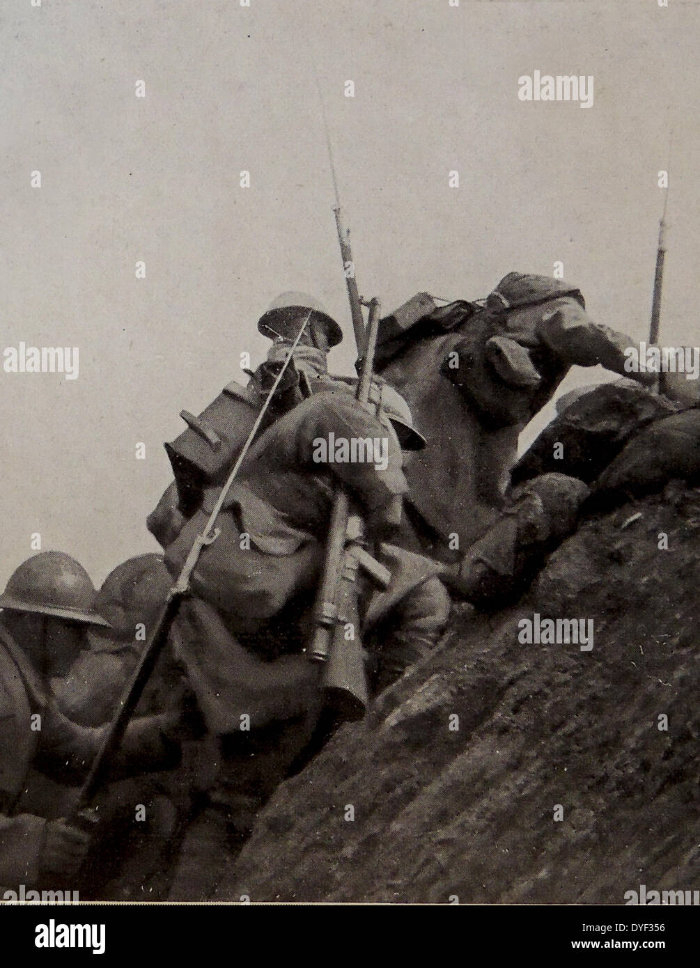 French soldiers go into battle as they climb out of a trench, in ...
