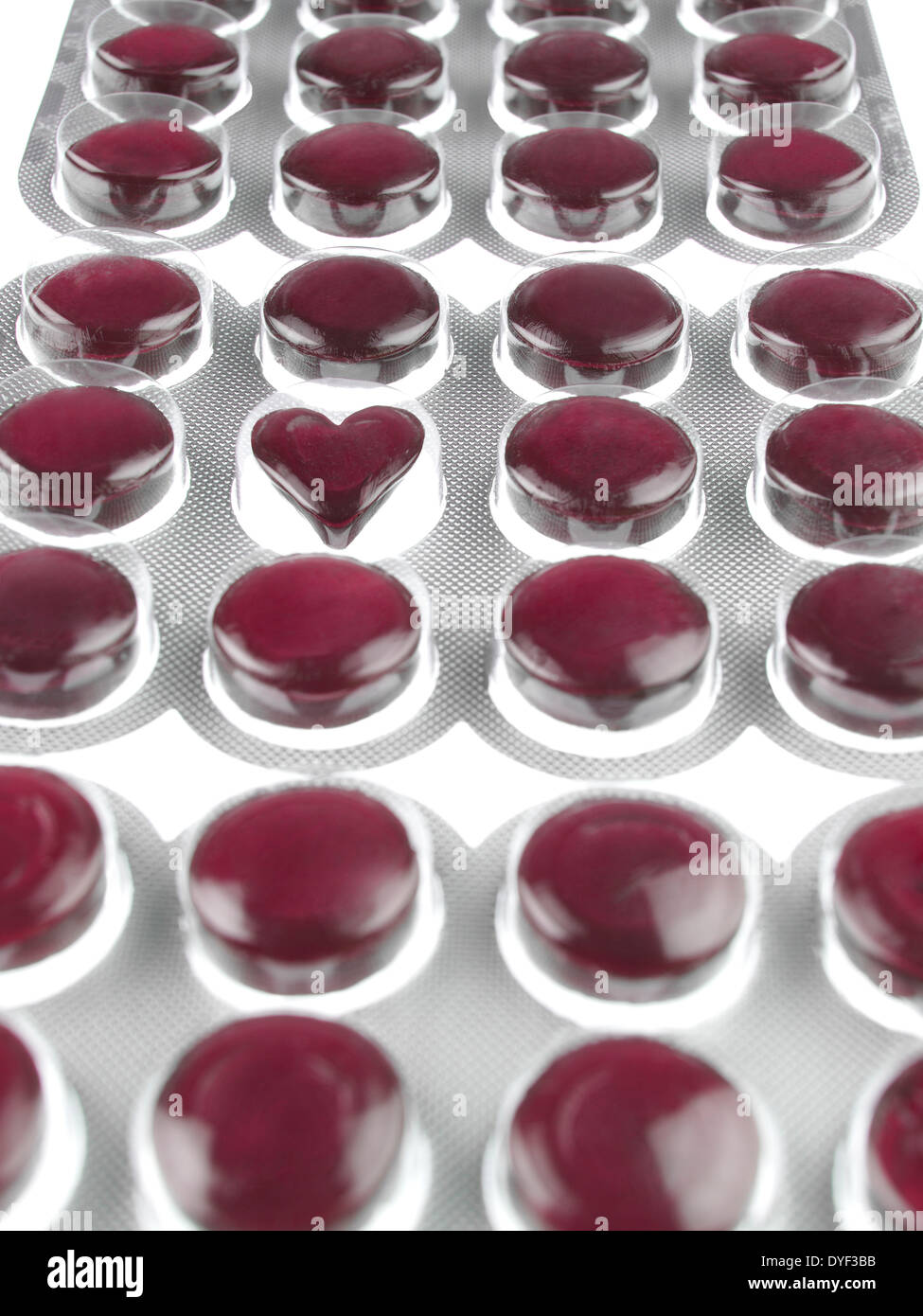 PACKETS OF RED THROAT LOZENGES WITH ONE AS A HEART Stock Photo - Alamy