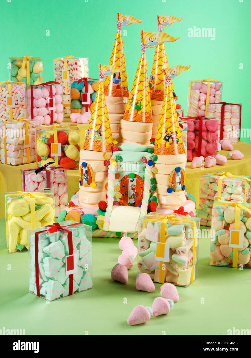 A COLLECTION OF DECORATED AND WRAPPED MARSHMALLOWS ON A GREEN ...
