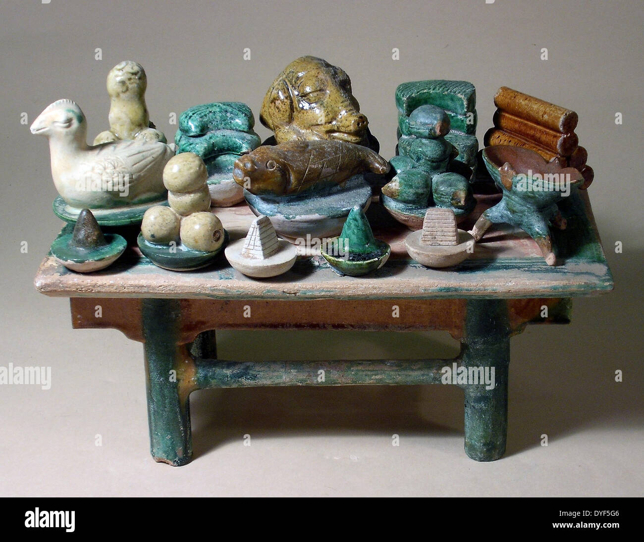 Ancient China: Offering table wth ceramic food objects. Glazed green ...