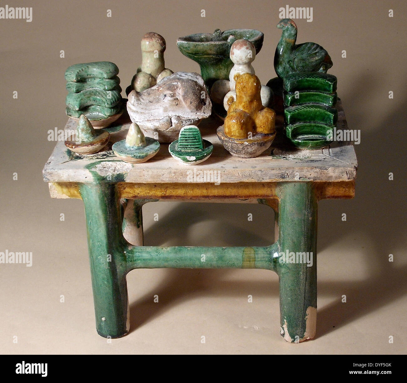 Ancient China: Offering table wth ceramic food objects. Glazed green ...