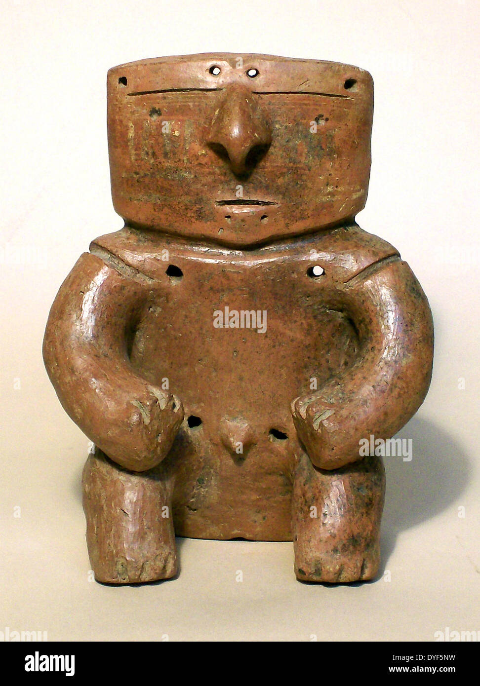 Pre-Columbian art: Slab-head terracotta seated figure, Quimbaya ...