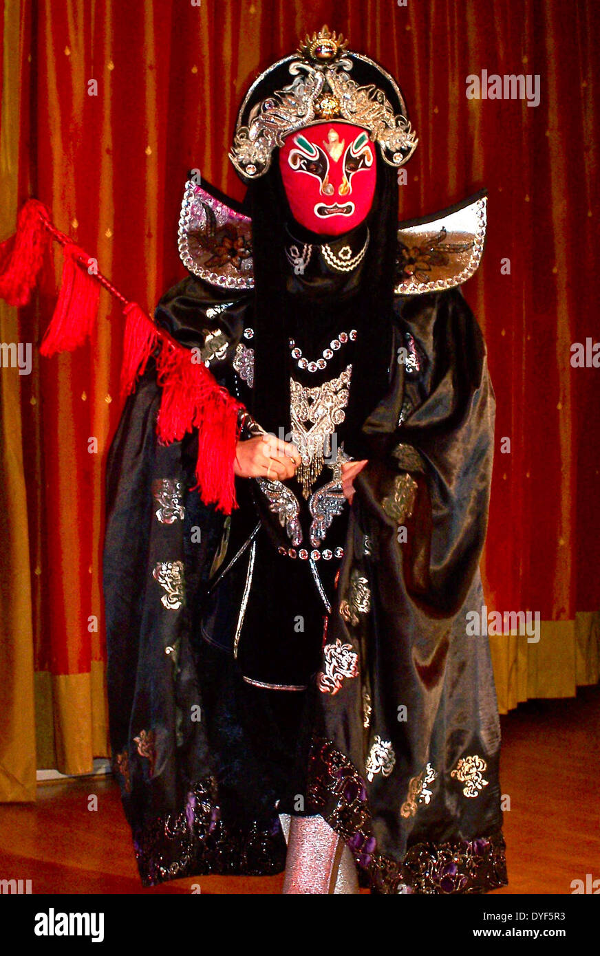 Multi-mask performer, Hong Kong, 2006. As he dances, the mask covering ...