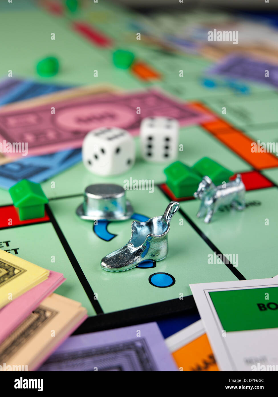 A CLOSE UP SHOT OF A MONOPOLY BOARD GAME WITH DICE MONEY AND CHARACTERS ...