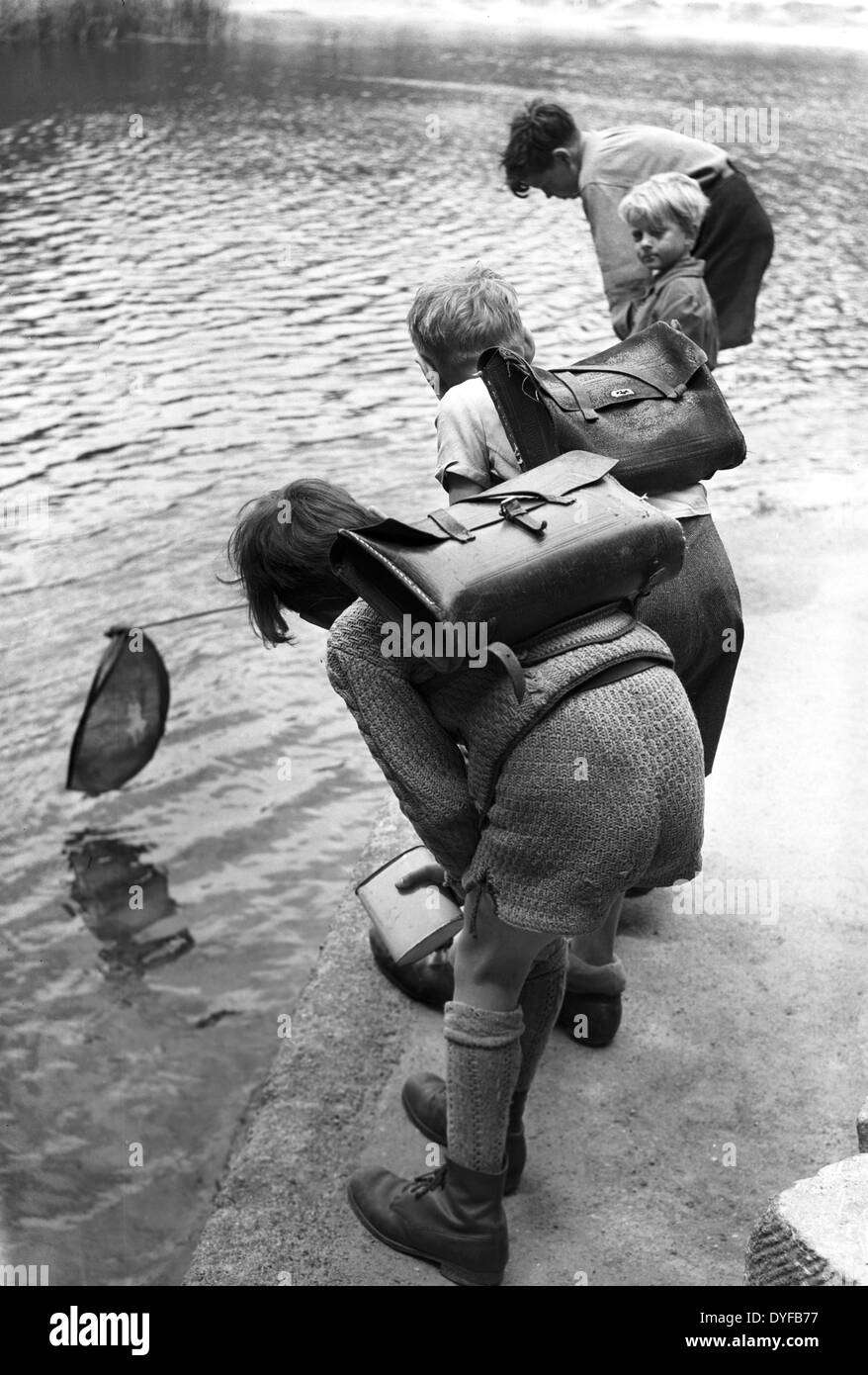 Children are trying to "fish" on their way home from school. Picture ...