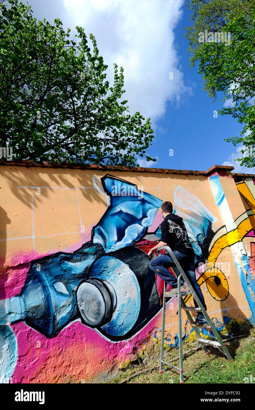 Wall decorated with graffiti with themes from the opera The Cunning ...