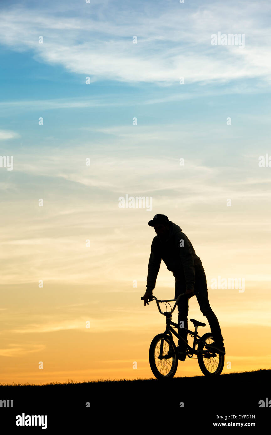 Young Man riding his BMX bike. Silhouette Stock Photo - Alamy