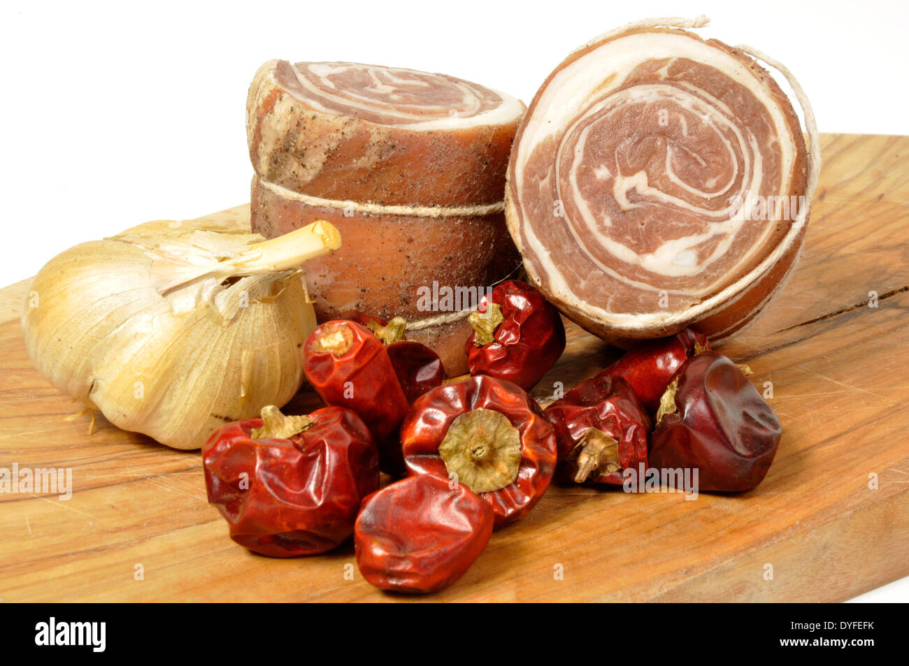 Smoked lamb pancetta chillies and garlic bulb Stock Photo - Alamy