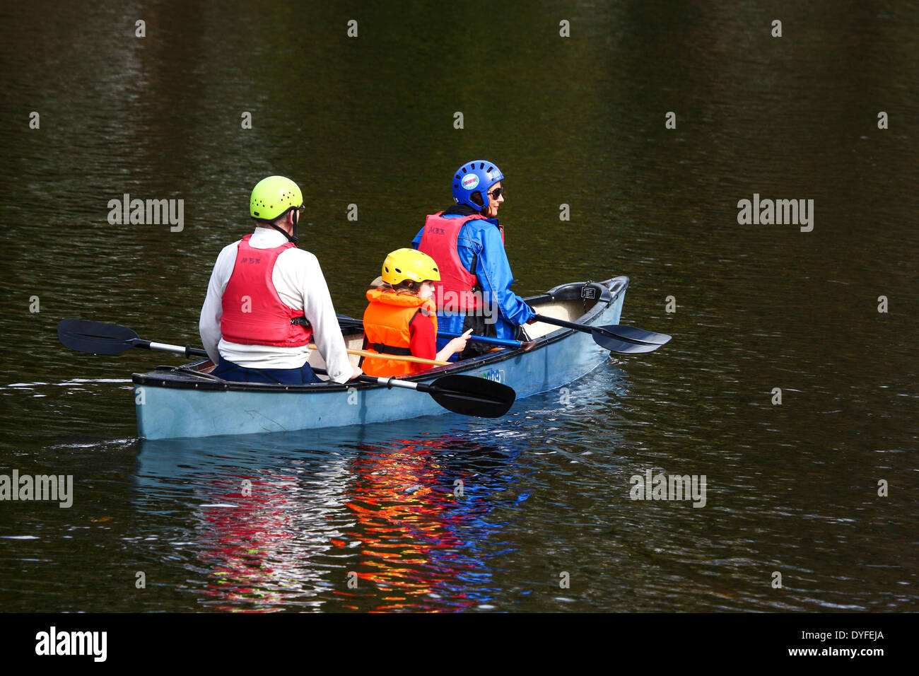 Family canoeing on river Wharf in Sping in Ilkley, West Yorkshire Stock ...