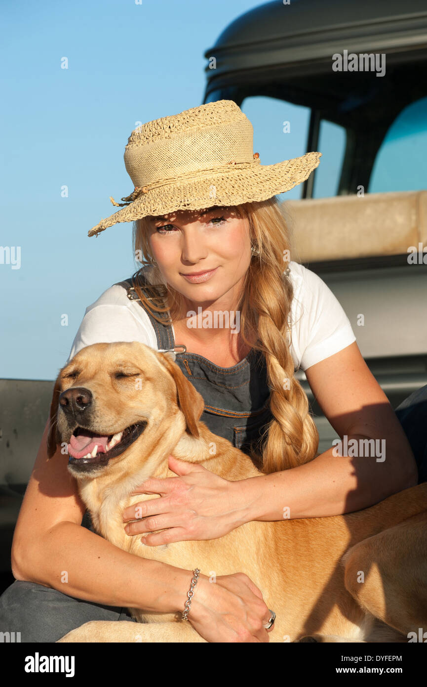 Woman with labrador retiever dog Stock Photo - Alamy