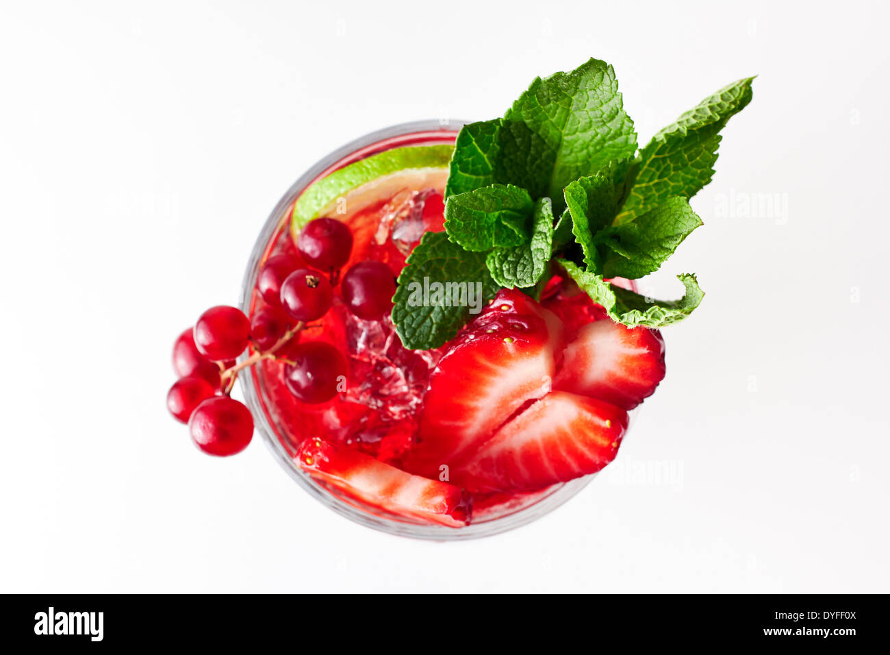 Healthy red berry cocktail with mint garnish. On white background. Top ...