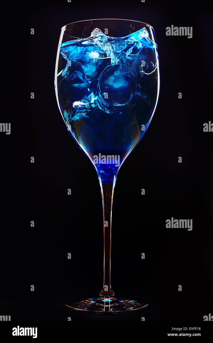 Amazing blue cocktail with ice cubes in high glass. Blue curacao liquor ...