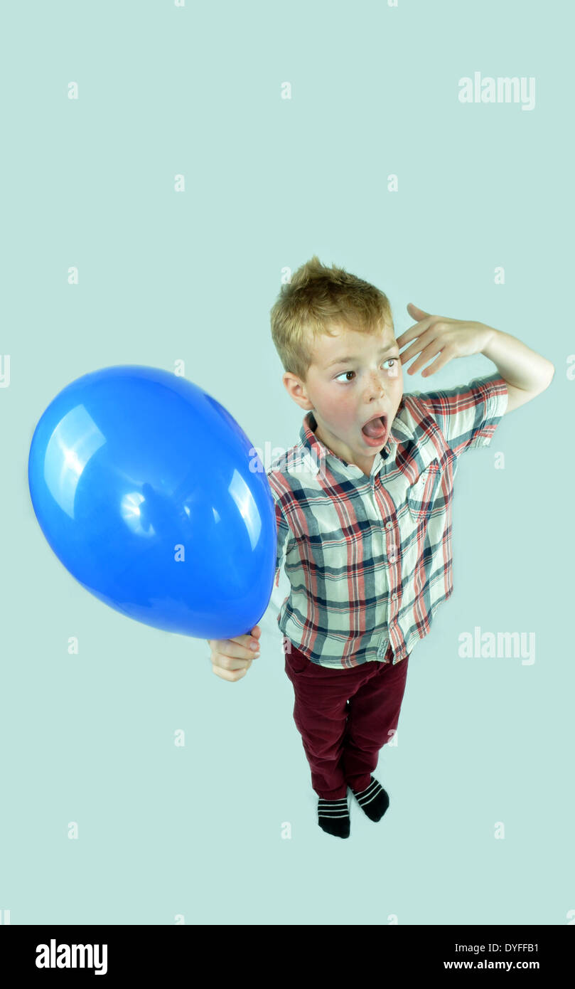 Small boy playing with balloon Stock Photo - Alamy