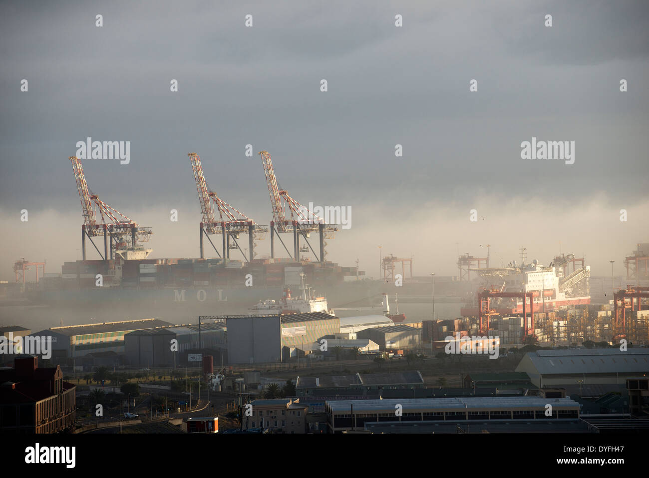 Early morning sea mist covering the docks in Cape Town South Africa ...