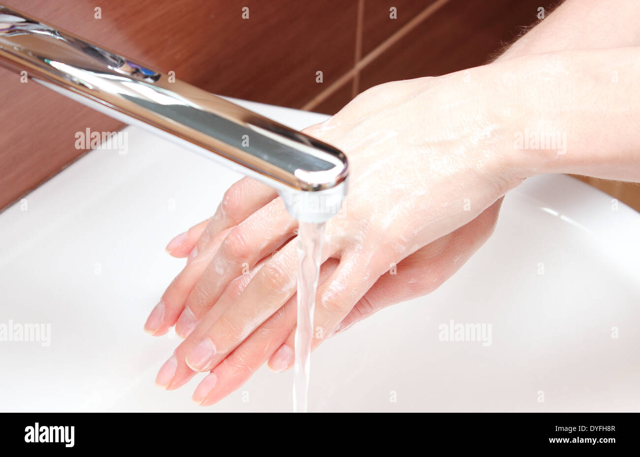 Washing of hands with soap under running water Stock Photo - Alamy