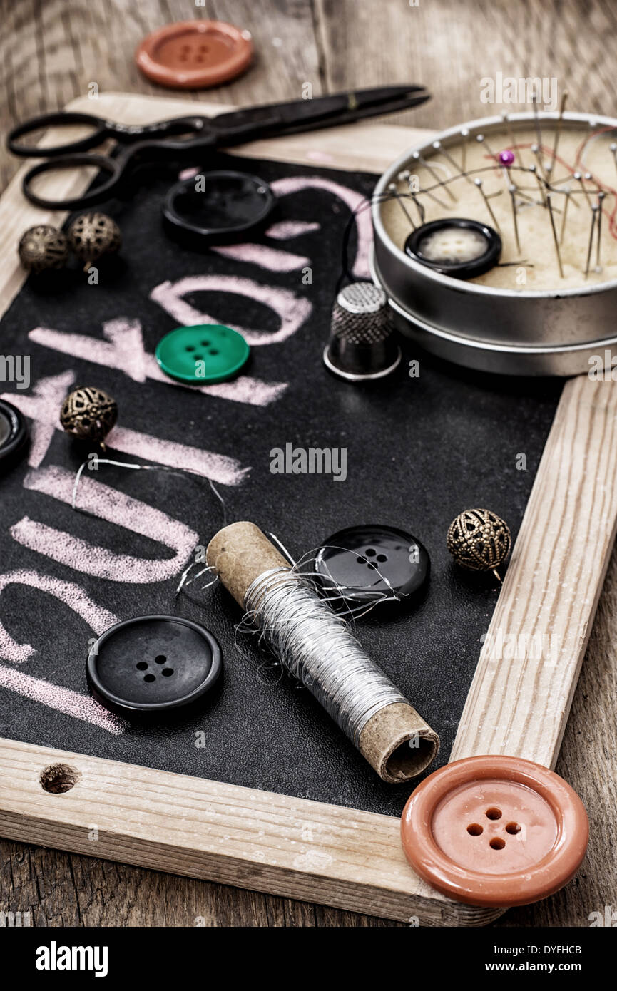 different buttons and zipper on the background of sewing tool Stock ...