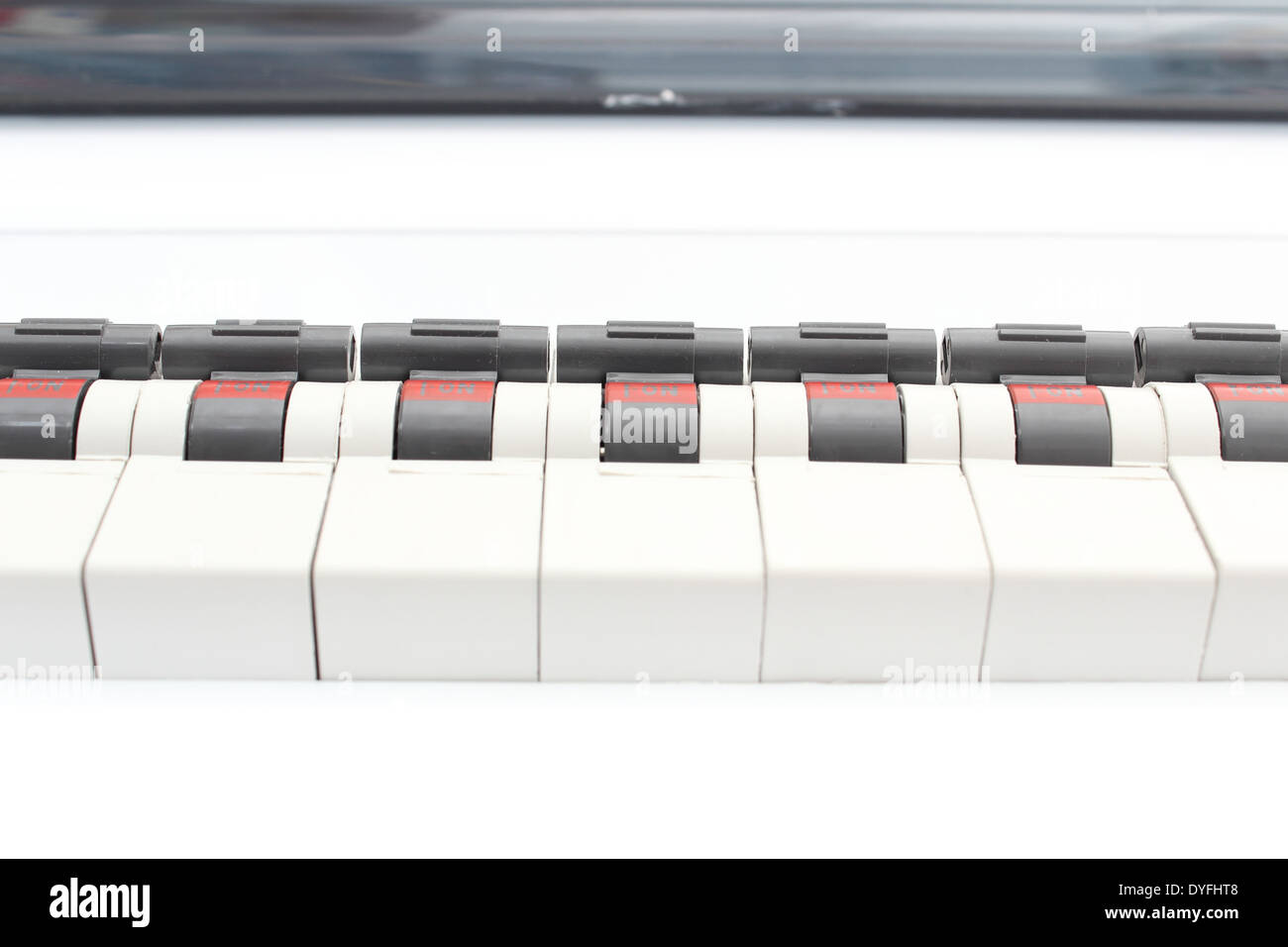 Electric switch on a white control panel Stock Photo - Alamy