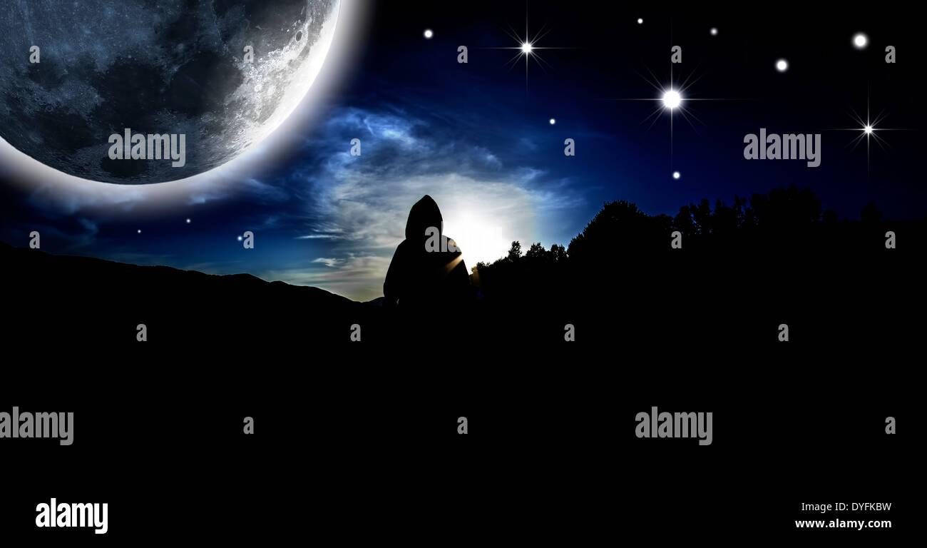 Starry Sky. Mystical figure in the rays of moonlight Stock Photo - Alamy