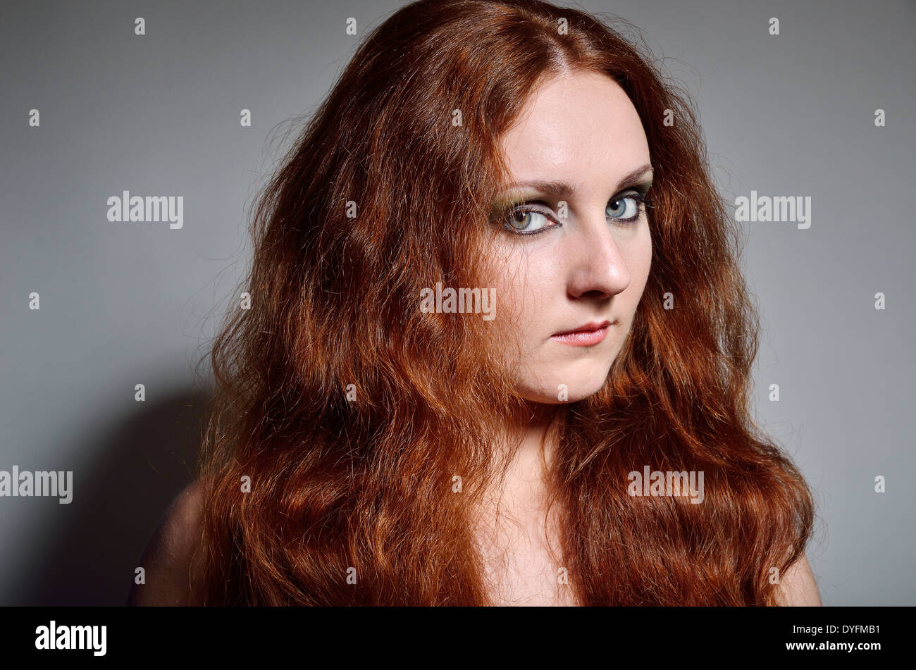 Close-up of serious ginger woman Stock Photo - Alamy