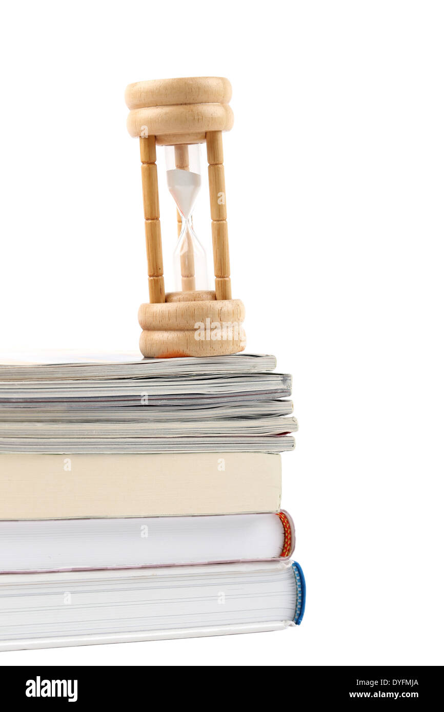 Hourglasses and book isolated Stock Photo - Alamy
