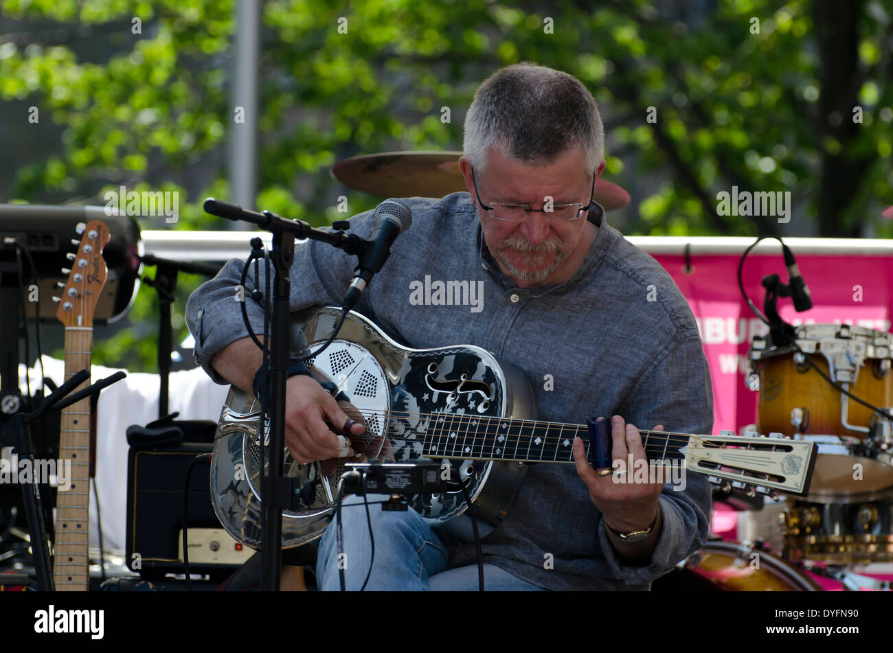 Singer and guitarist Al Hughes performing at the Mardi Gras, part of ...