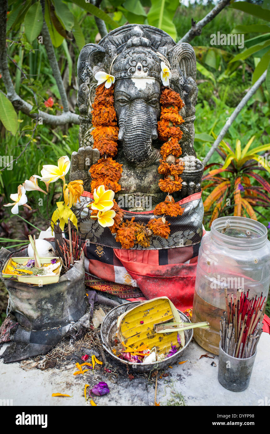 Temple offerings on a shrine to Hindu God, Bali, Indonesia Stock Photo ...