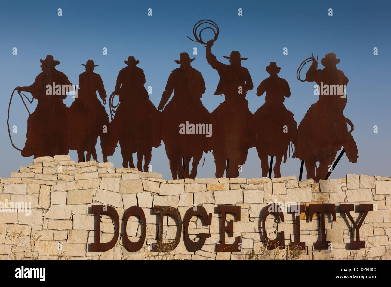 USA, Kansas, Dodge City, city sign with cowboy silhouettes, late ...