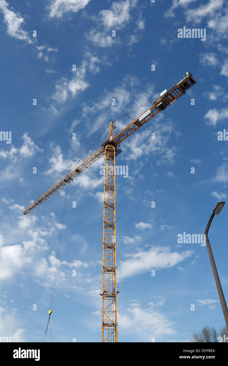 Tall construction crane on a building site Stock Photo - Alamy